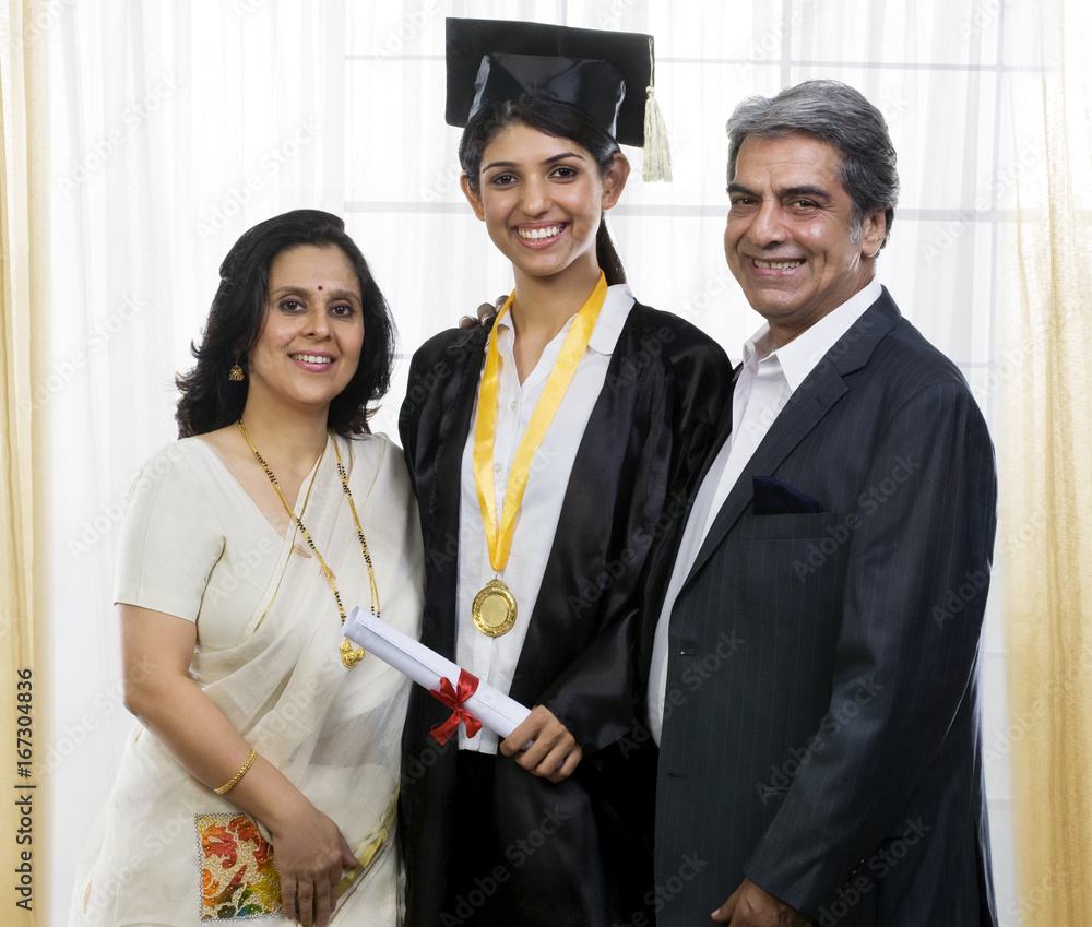 Girl posing with her parents Stock Photo | Adobe Stock