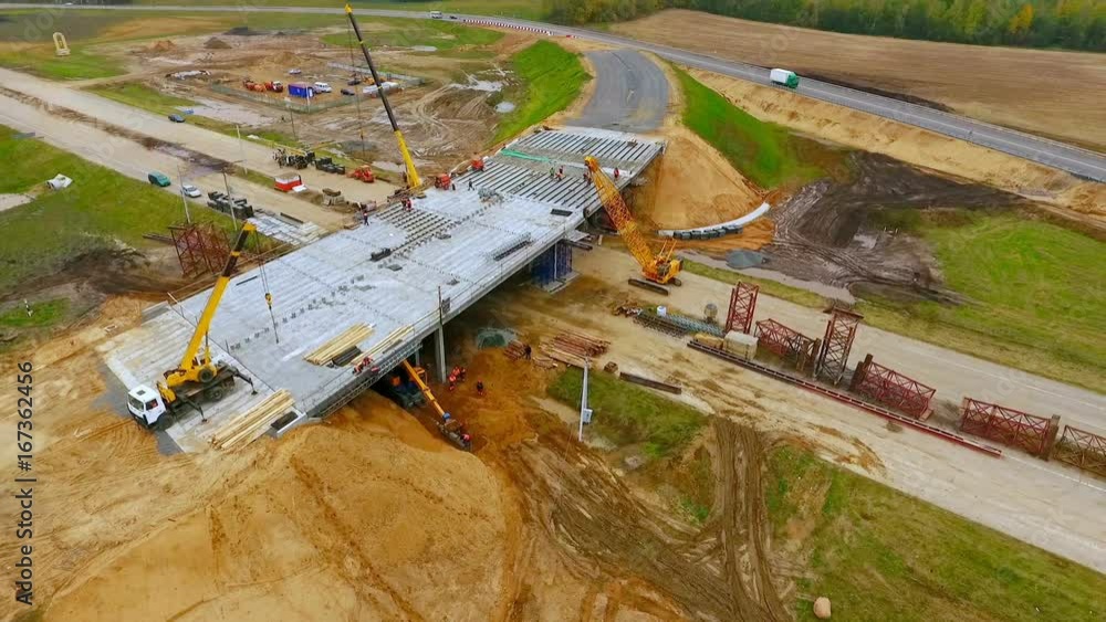 Road junction construction. Top view. Bridge construction on suburban ...