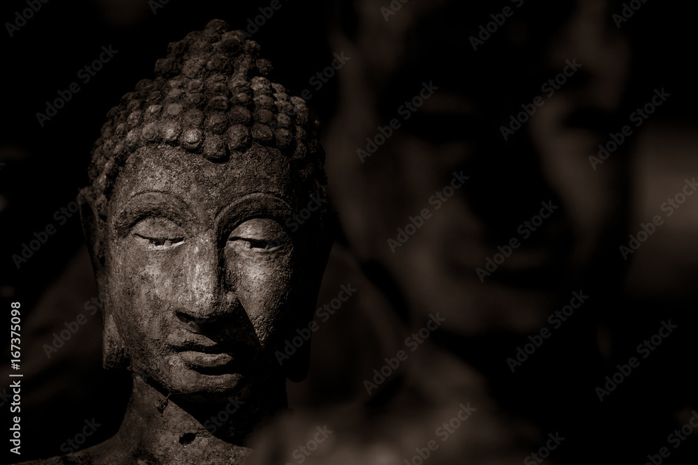 Head of Buddha statue in the dark, the dark side of Buddha, antique and ...