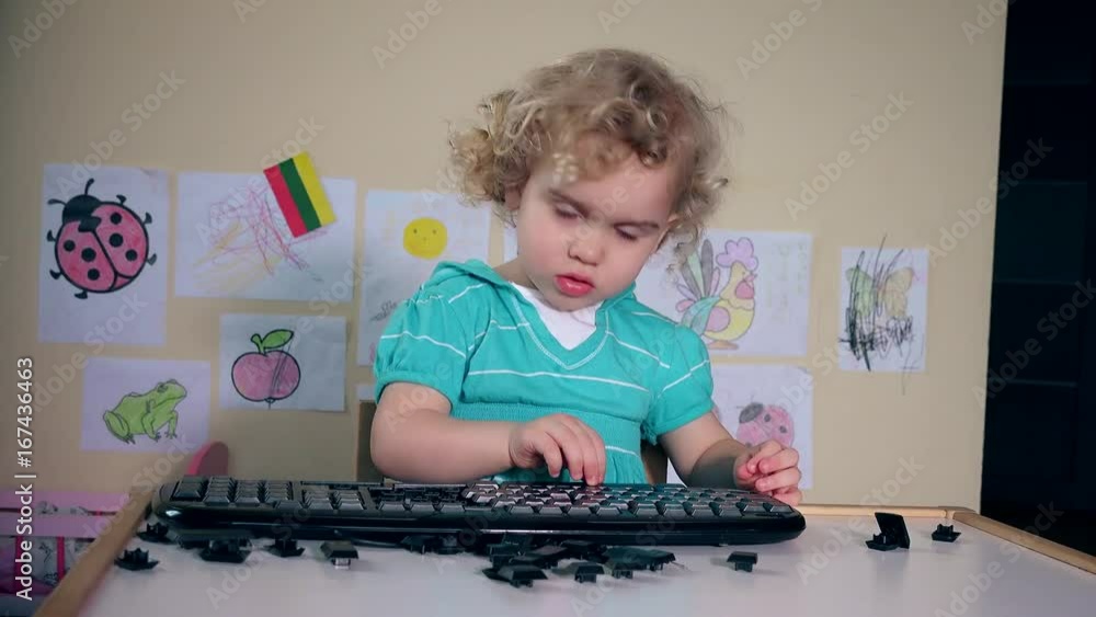 Naughty little child destroy computer keyboard on table Stock Video ...