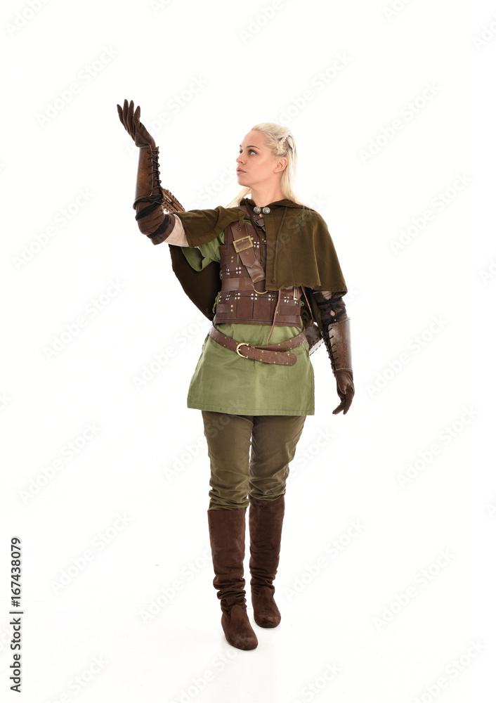 full length portrait of a blonde girl wearing green and brown medieval ...