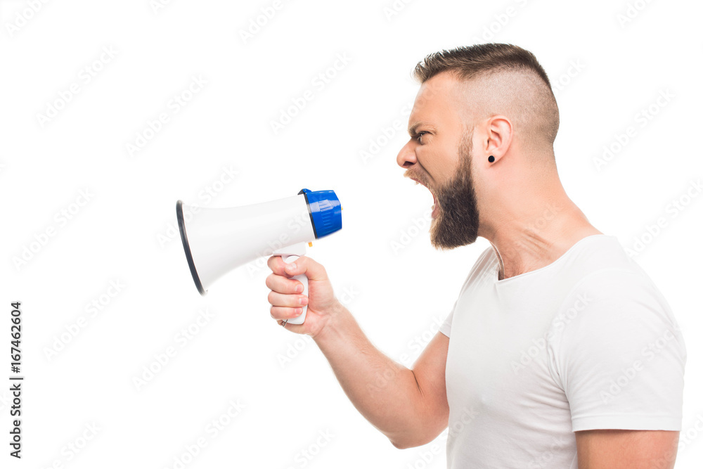 'Portrait og young aggressive man using megaphone, isolated on white ...