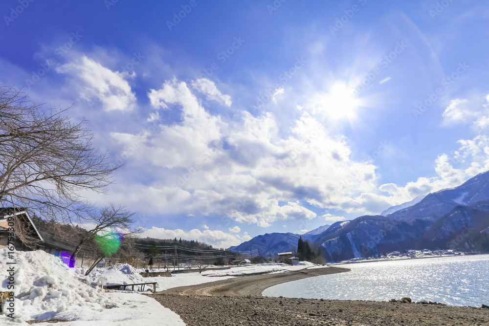 Hakuba mountain range and Lake in the winter with snow on the mountain ...