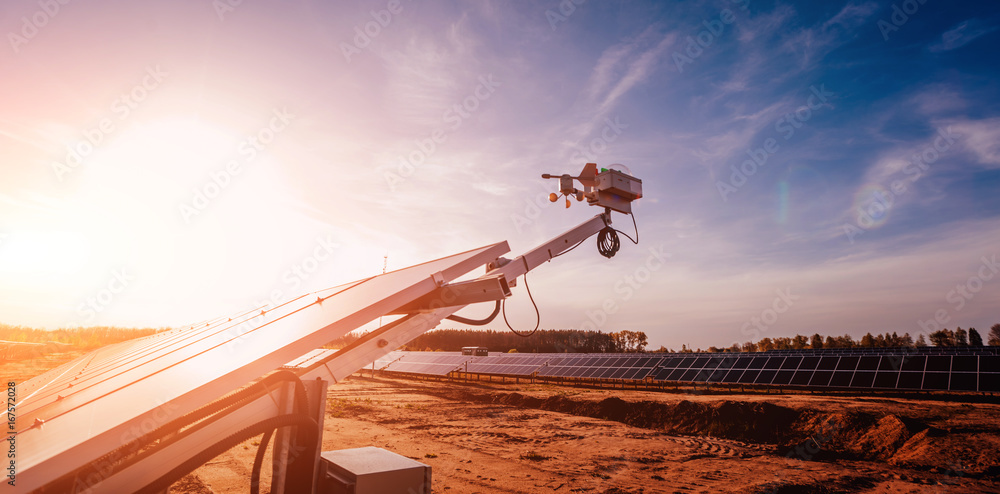 Back view of solar panel. Turning gear for tracking the sun and correct ...