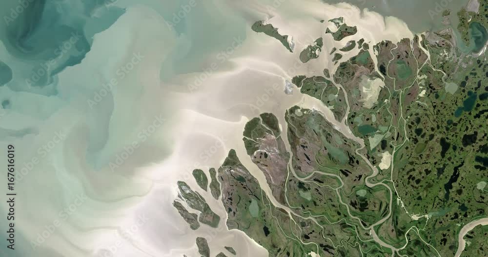 Very high-altitude overflight aerial of the Mackenzie River delta at ...