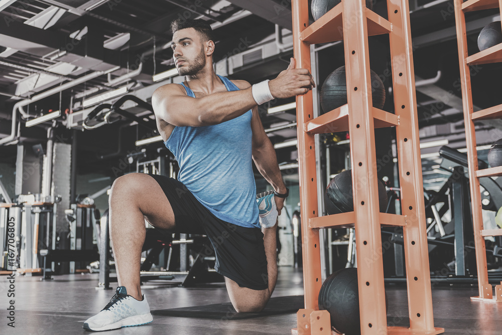 Serene athlete taking physical exercise Stock Photo | Adobe Stock