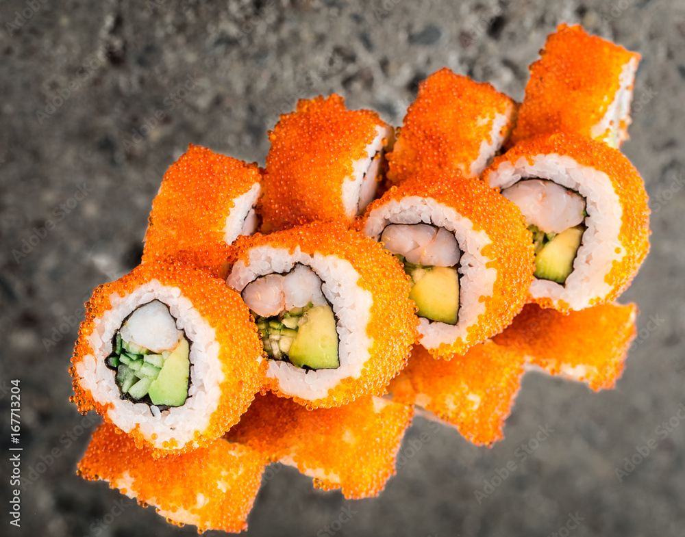 California roll made with tobiko, shrimp, avocado Stock-Foto | Adobe Stock