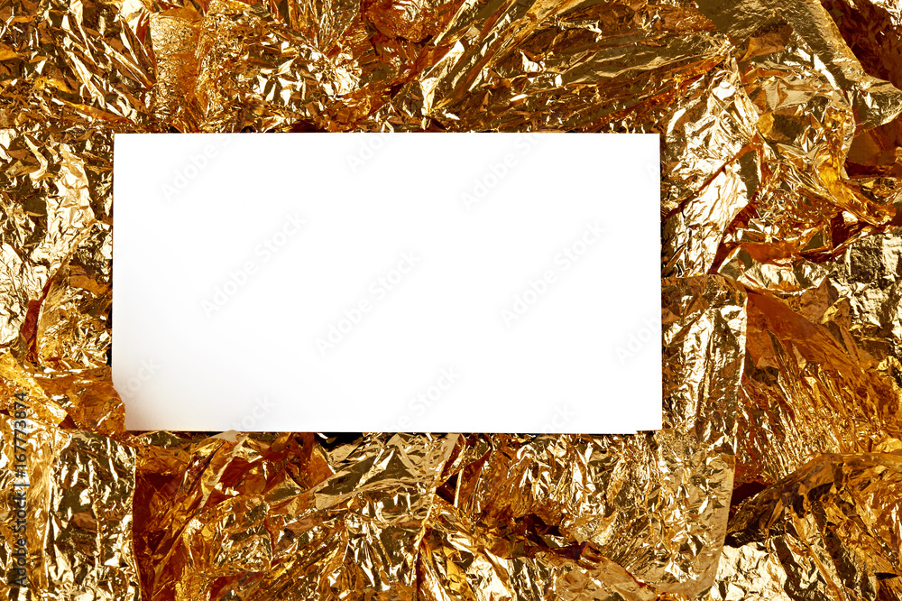 Gold background. White card on the gold leaf texture. Stock Photo ...