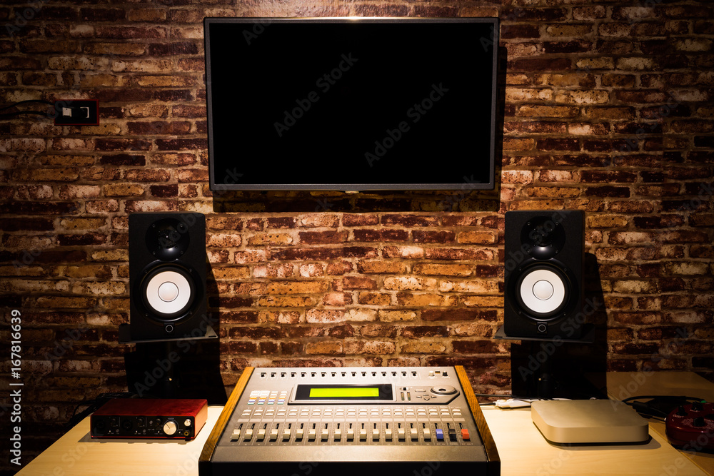 digital sound mixer, monitor speakers & LED screen in recording studio ...
