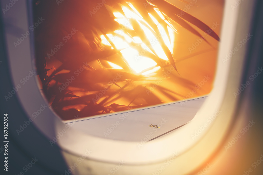 Sunset as seen through window of an aircraft. Stock Photo | Adobe Stock