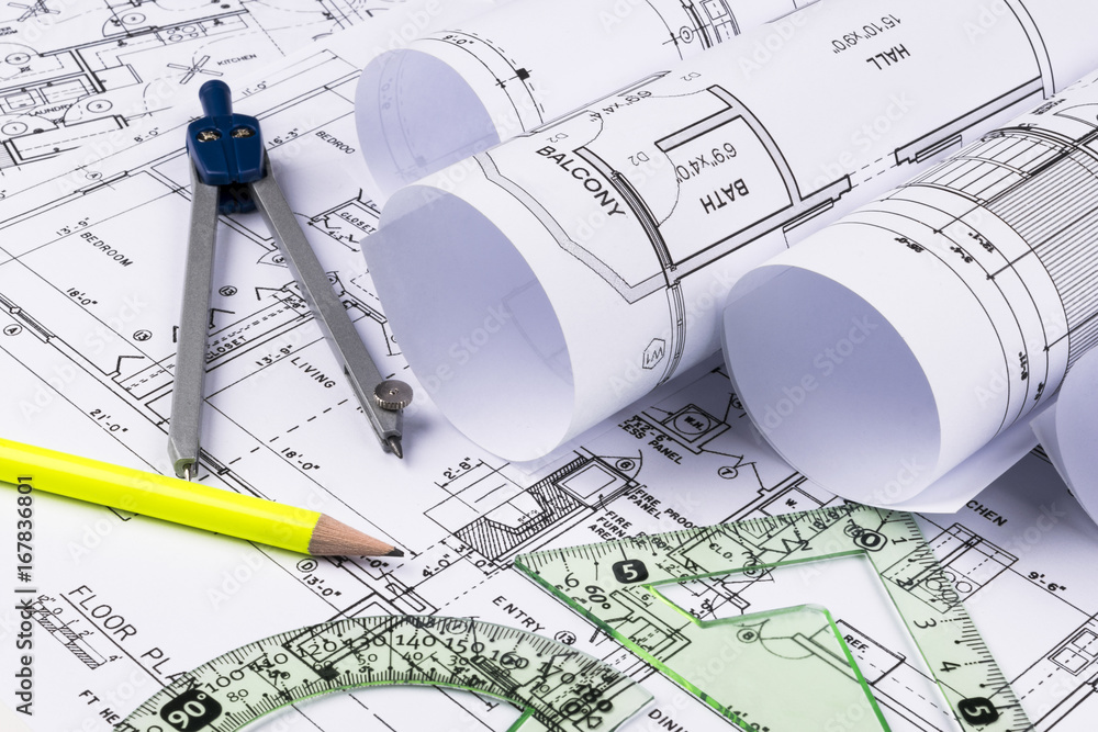 Architectural blueprints and blueprint rolls and a drawing instruments ...