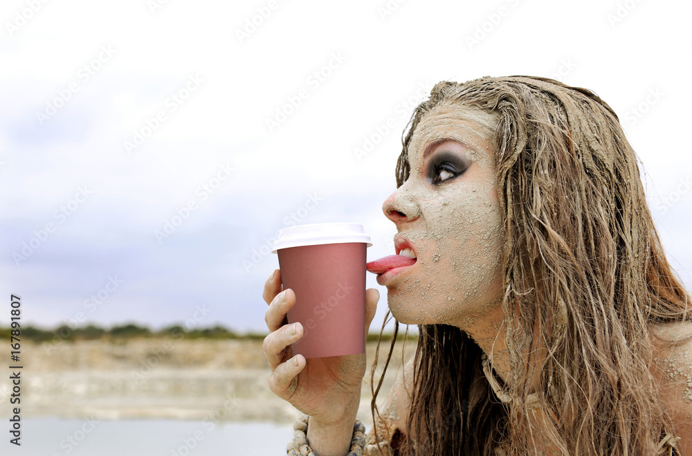 A girl gets herself made up as a prehistoric cave woman and is covered ...