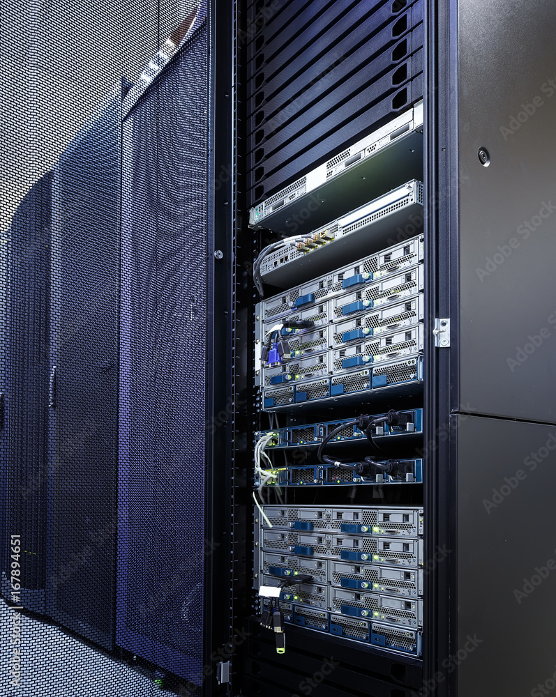 stand with supercomputers of the modern data center with the door open ...