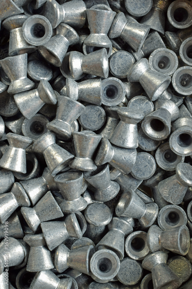 Air gun pellets background. Vertical image. Stock Photo | Adobe Stock