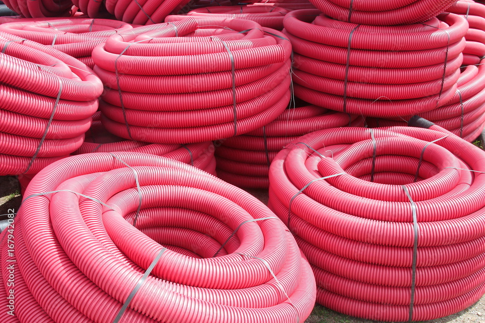 Red corrugated plastic pipes used for underground electrical lines ...