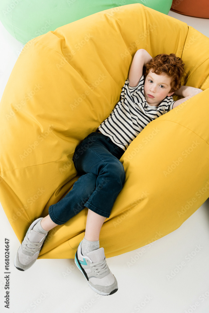 child on bean bag chair Stock Photo | Adobe Stock
