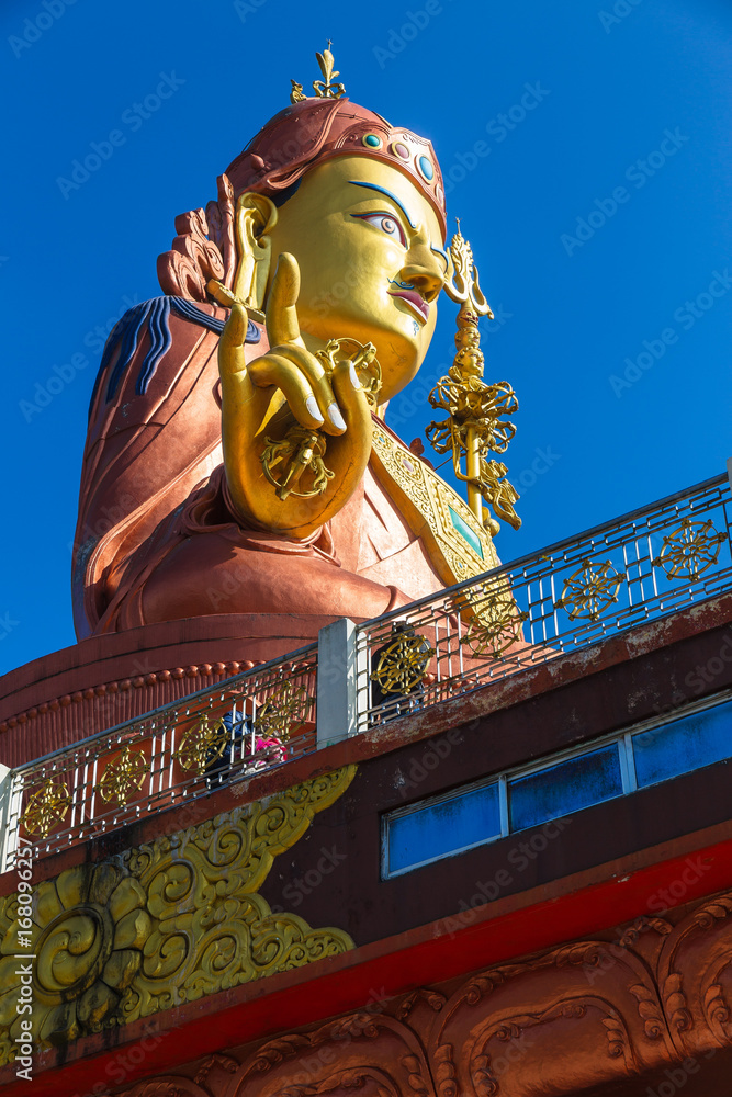 Close up at the side Statue of Guru Rinpoche, the patron saint of ...