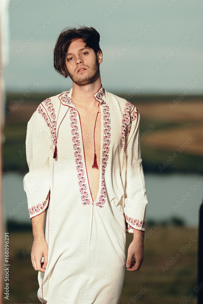 Foto de White man wearing sexy long neck outfit. His eyes are looking ...