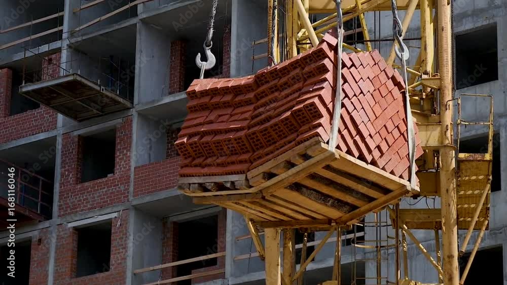 Crane and building construction site against blue sky. heavy load ...