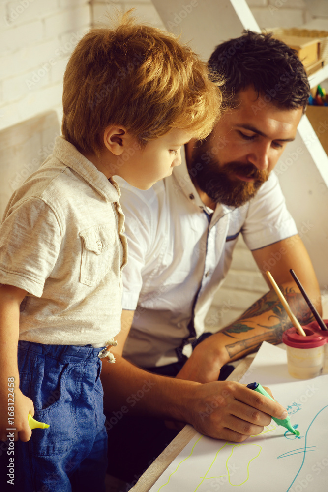 Team work drawing, father and son paint together, father teaches his ...