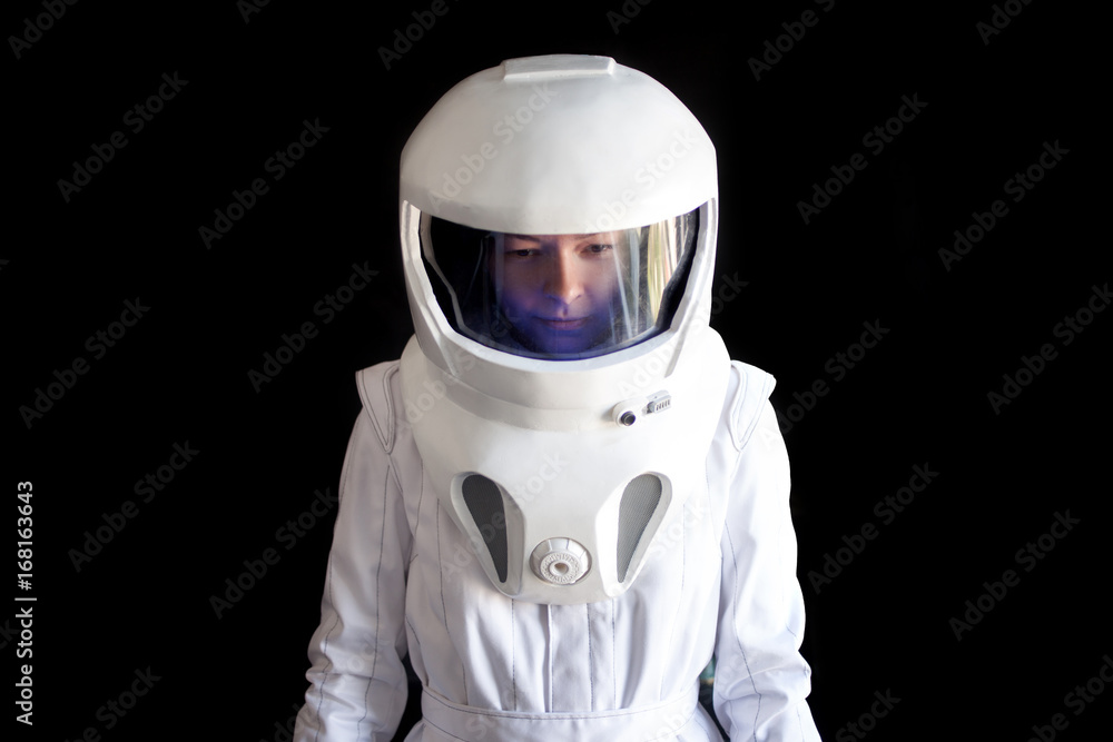 Astronaut in a helmet looks down. Fantastic space suit. Exploration of ...
