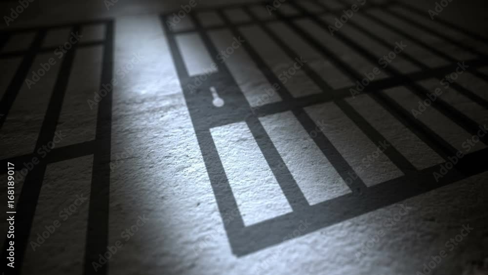 Jail cells iron bars casting shadows on the prison floor. Stock 비디오 | Adobe Stock