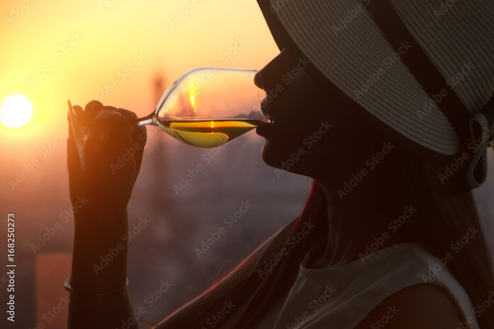 Girl drinking white wine at the sunset in paris city Stock Photo ...