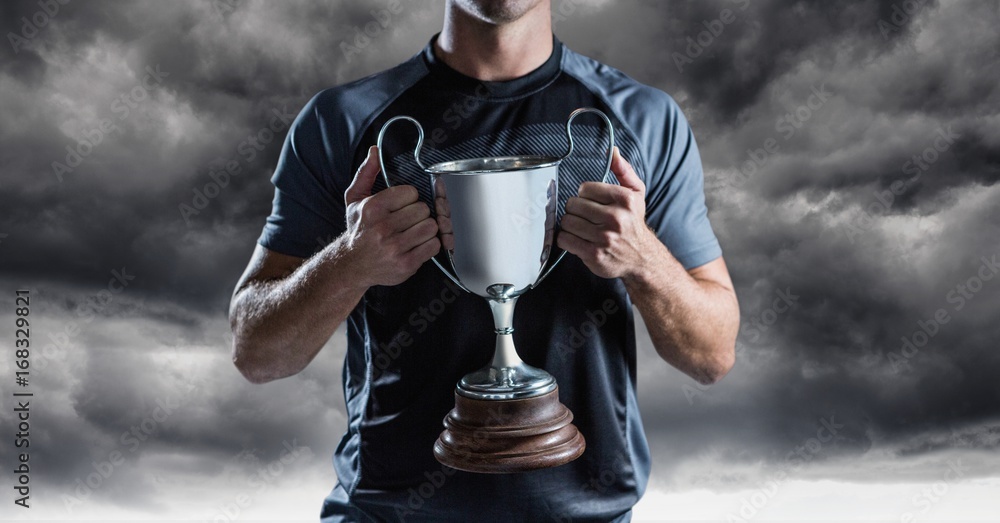 Man with a trophy on hands Stock Photo | Adobe Stock