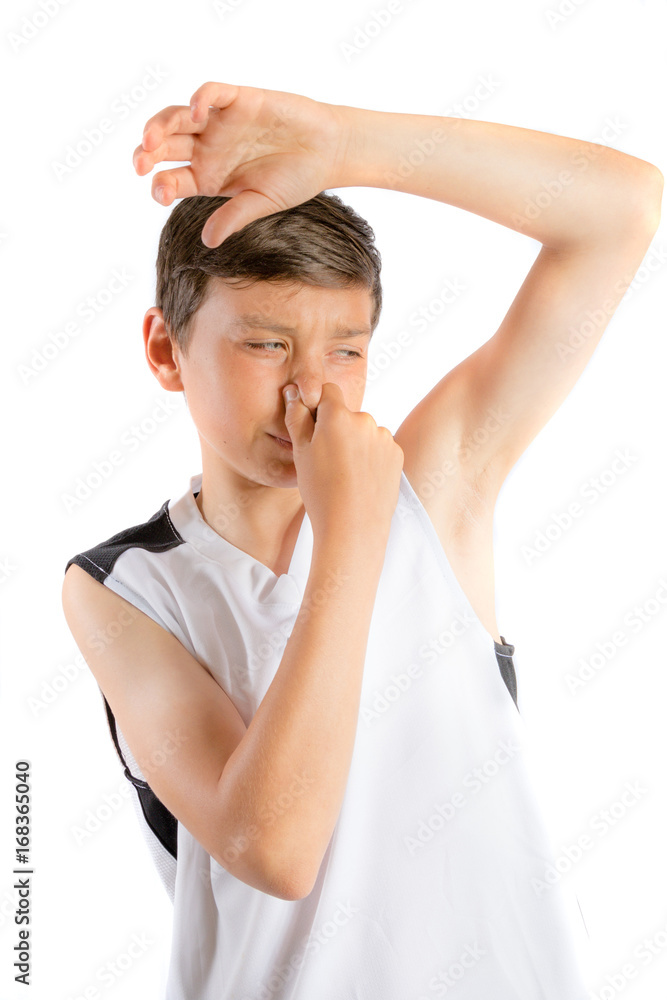 Young teenage boy isolated on a white background with smelly armpit ...