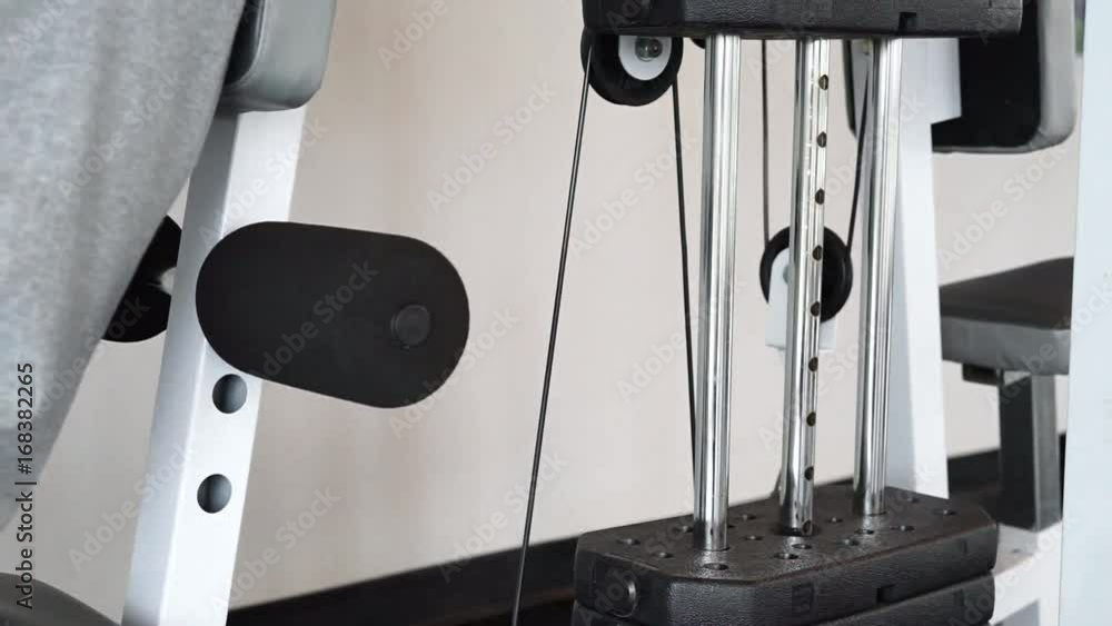 plates weighs stack moves, lifts, rises and pulls up in fitness gym ...