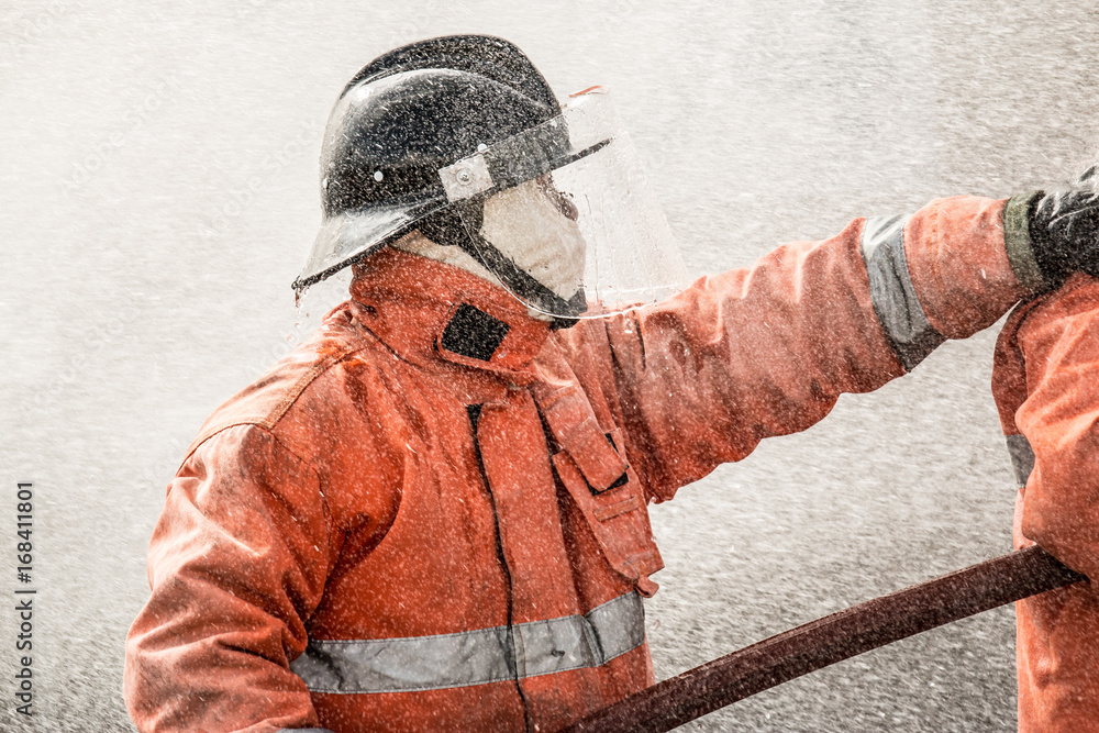 Firefighter searching for possible survivors with tools, tacticle ...