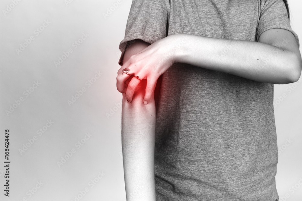 Girl in grey shirt scratching her arm. Scabies. Scratch the hand Stock ...