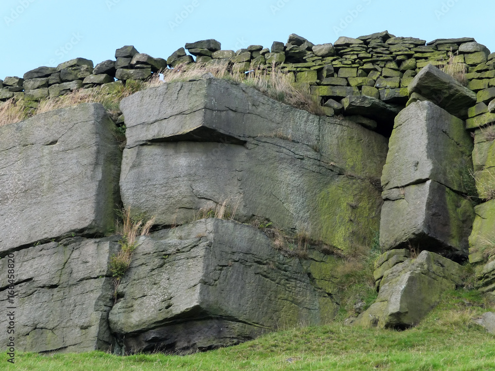 dramatic stone outcrop in yorkshire moors with craggy sandstone texture ...