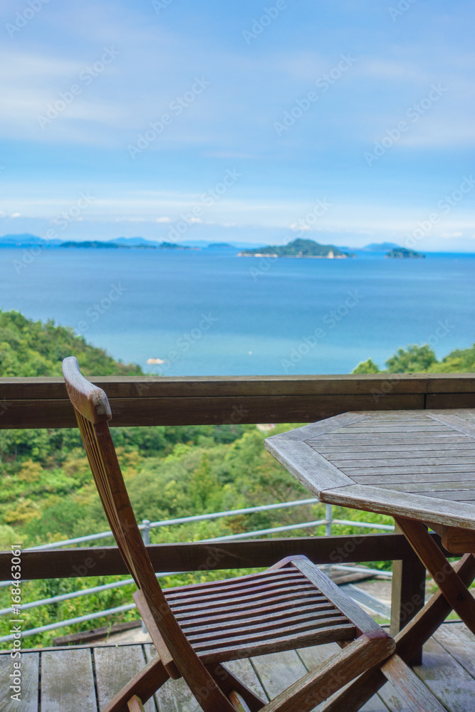 Terrace chair and table of a hotel and Setonaikai (Seto Inland) Sea ...