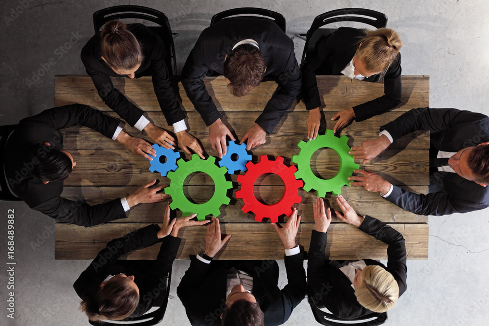 Business people with cogs of business Stock Photo | Adobe Stock