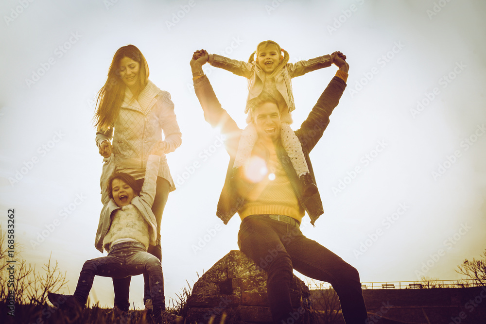 Happy family playing outdoor. Family enjoying together in nature ...