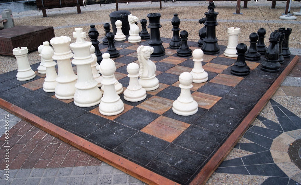 Giant outdoor chess set with huge chess pieces Stock Photo | Adobe Stock