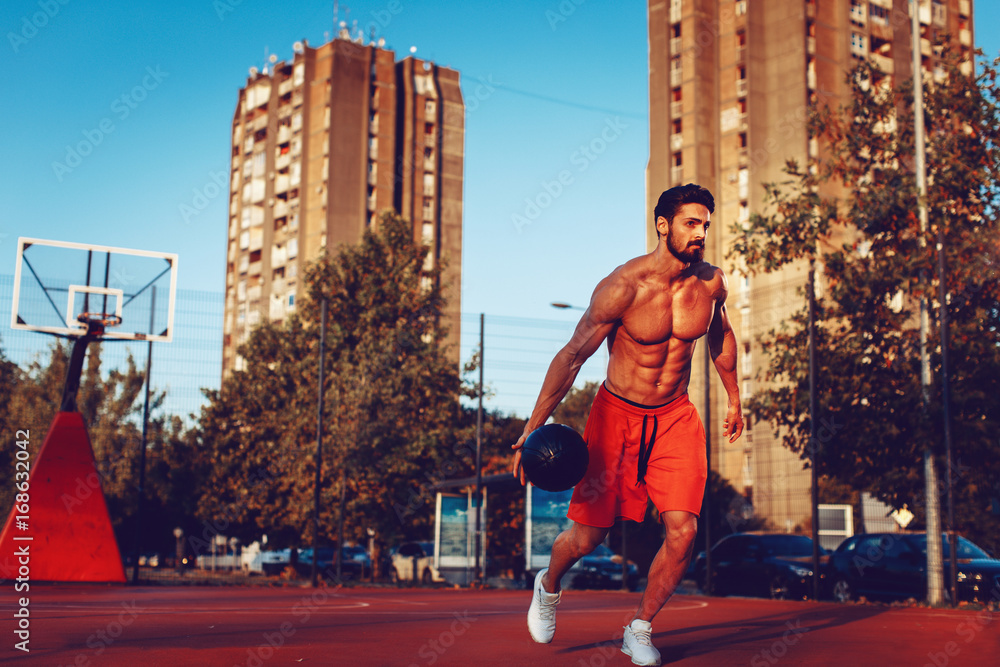 Shirtless handsome man playing basketball Stock Photo | Adobe Stock