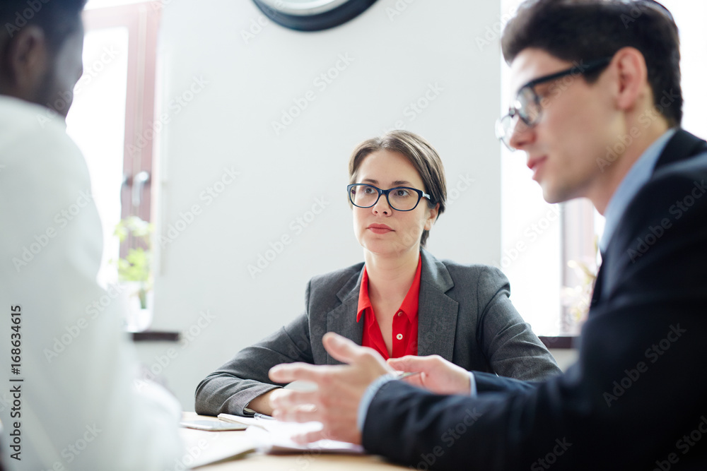 Confident employers talking to applicant at interview Stock Photo ...