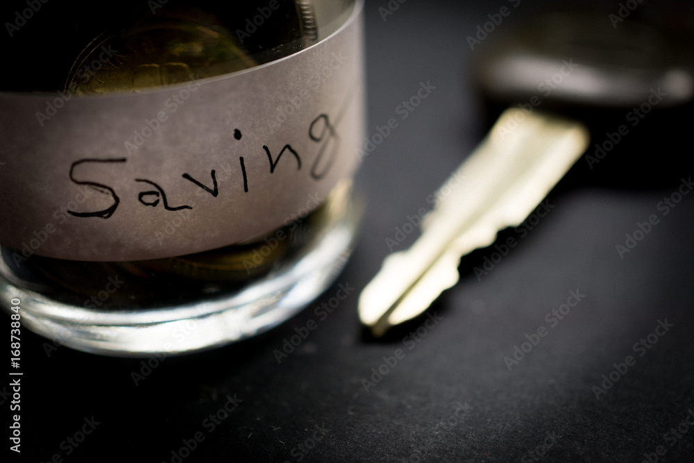 Blur Saving bottle with blur car key in black background, dark tone ...