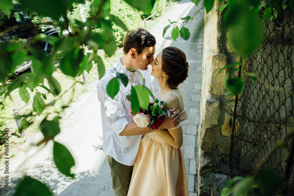 Top view of beautiful wedding couple hugging under green tree. Photo ...