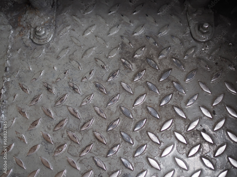Old dirty grey steel checker plate pattern, embossed texture ...