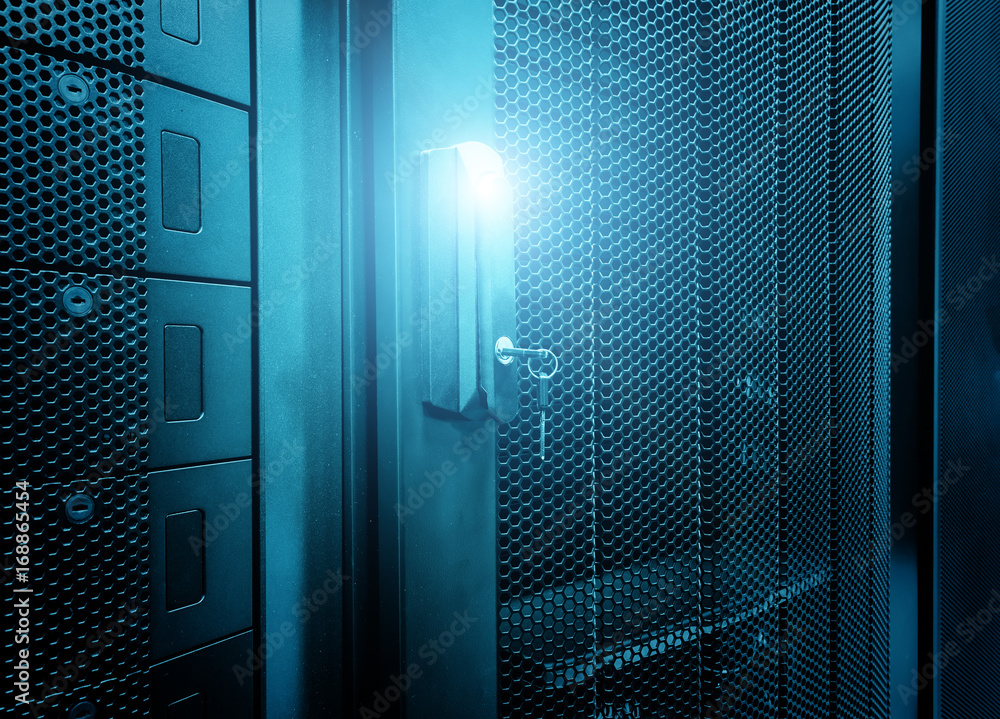 Door perforated of server rack cabinet. The key is inserted into door ...