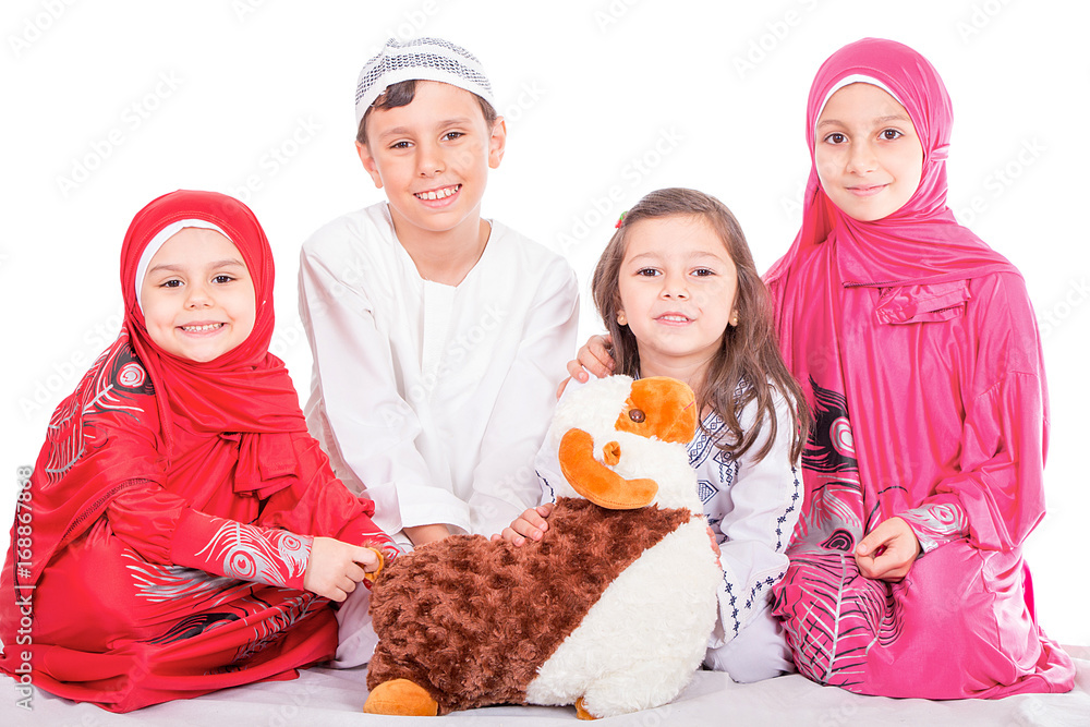 Happy little Muslim kids playing with sheep toy - celebrating Eid ul ...