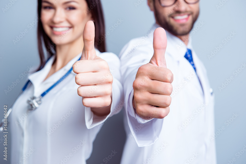 Great job! Close up cropped photo of two medic colleagues in white ...