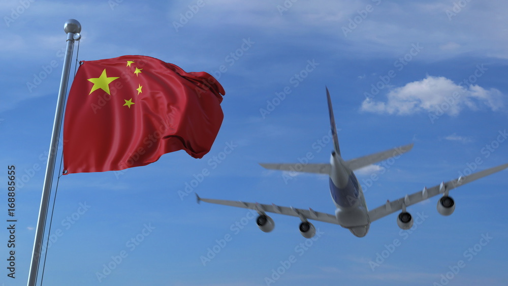 Commercial airplane landing behind waving Chinese flag. Travel to China ...