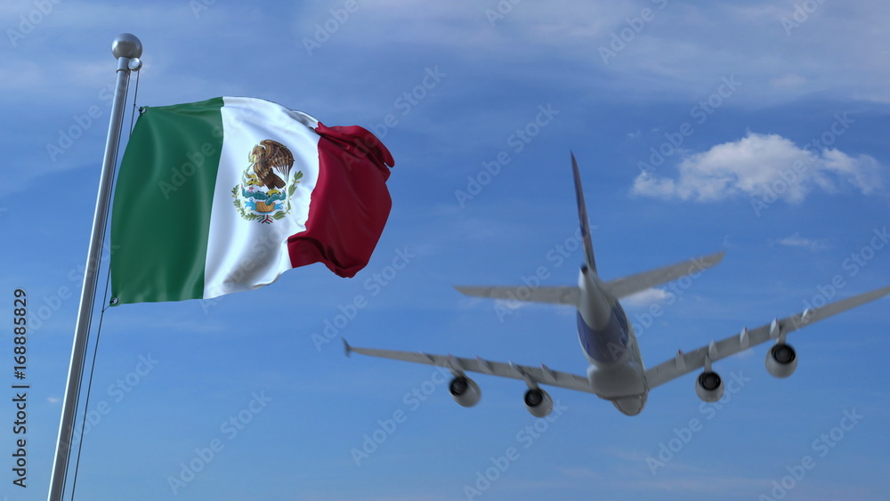 Commercial airplane landing behind waving Mexican flag. Travel to ...