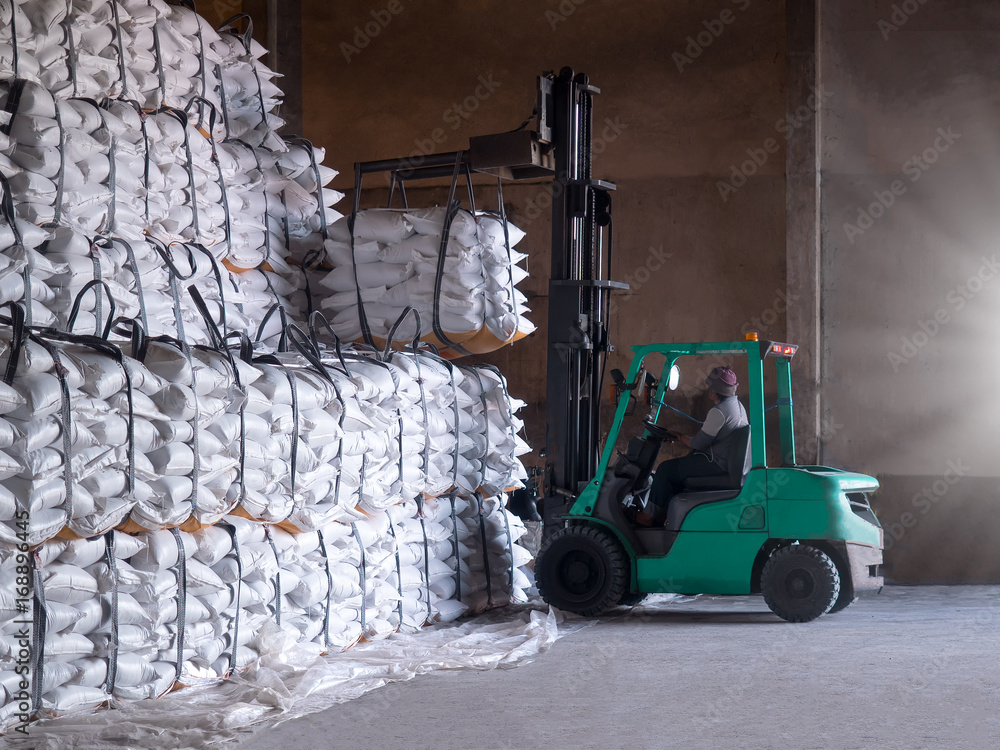 Sugar in bags handling to stacking in warehouse by forklift for export ...
