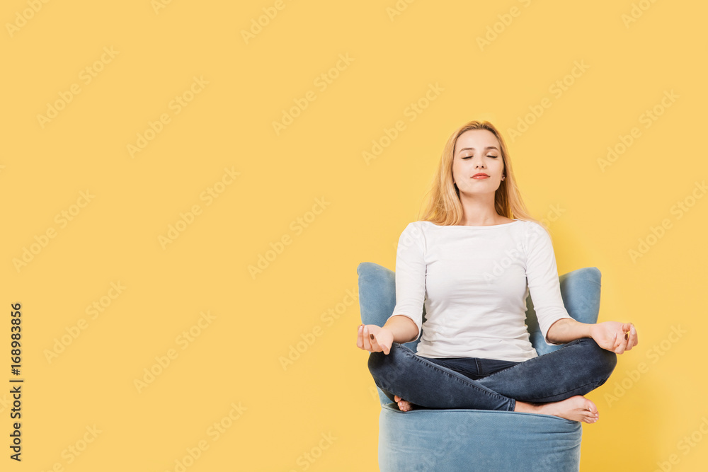 Young woman relaxing on chair. Picture includes copy space Stock Photo ...