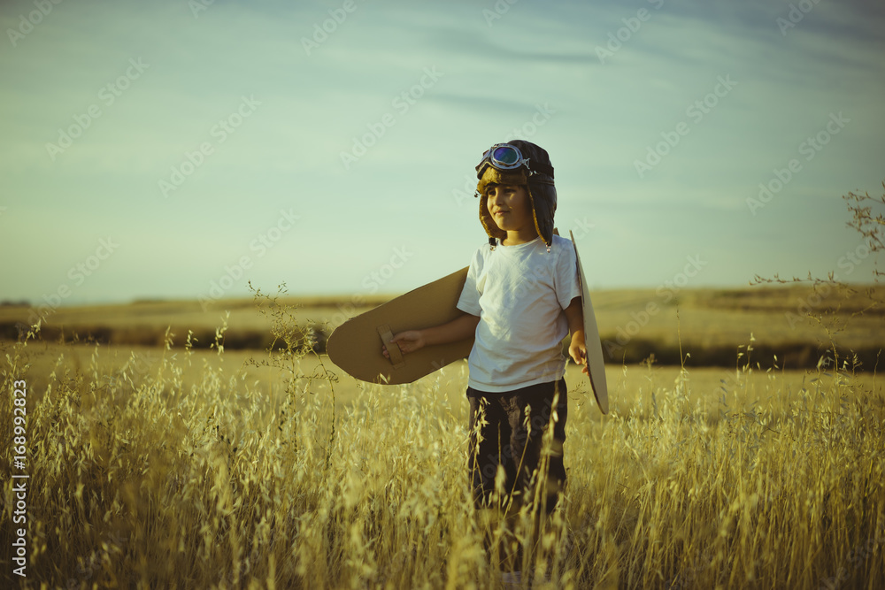 Success, Boy playing to be airplane pilot, funny guy with aviator cap ...